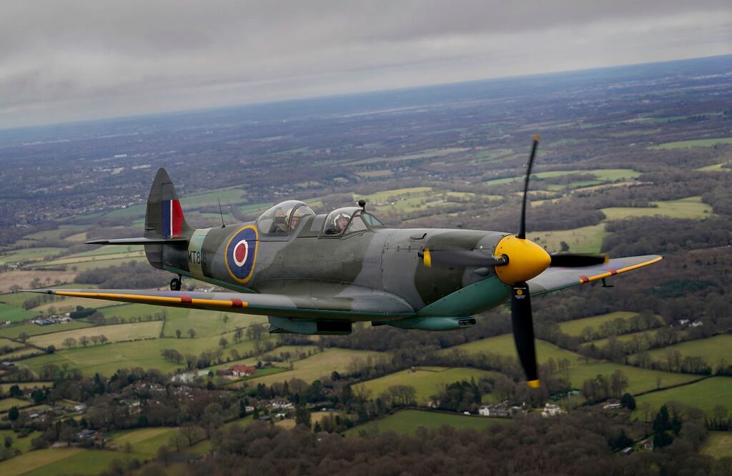 102-year-old British veteran flies Spitfire on bumpy charity ride