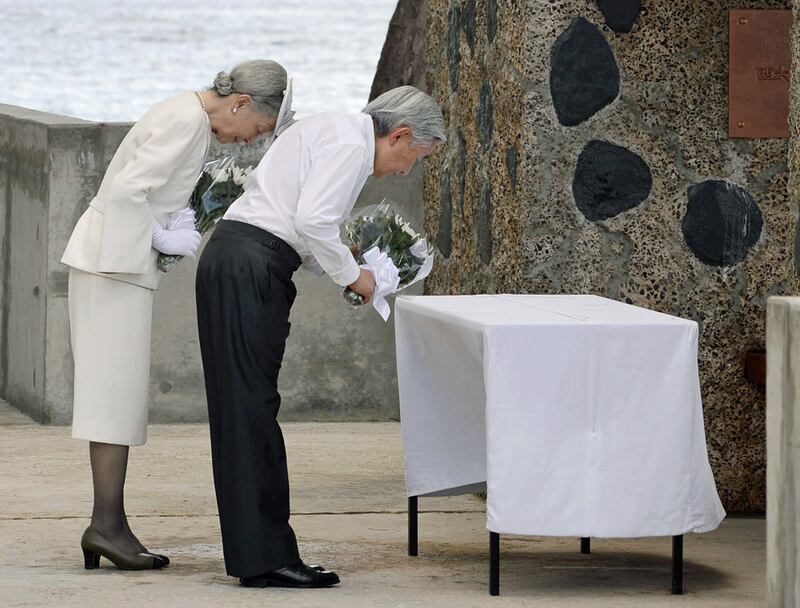 Japan's emperor prays at WWII battleground on Pacific island