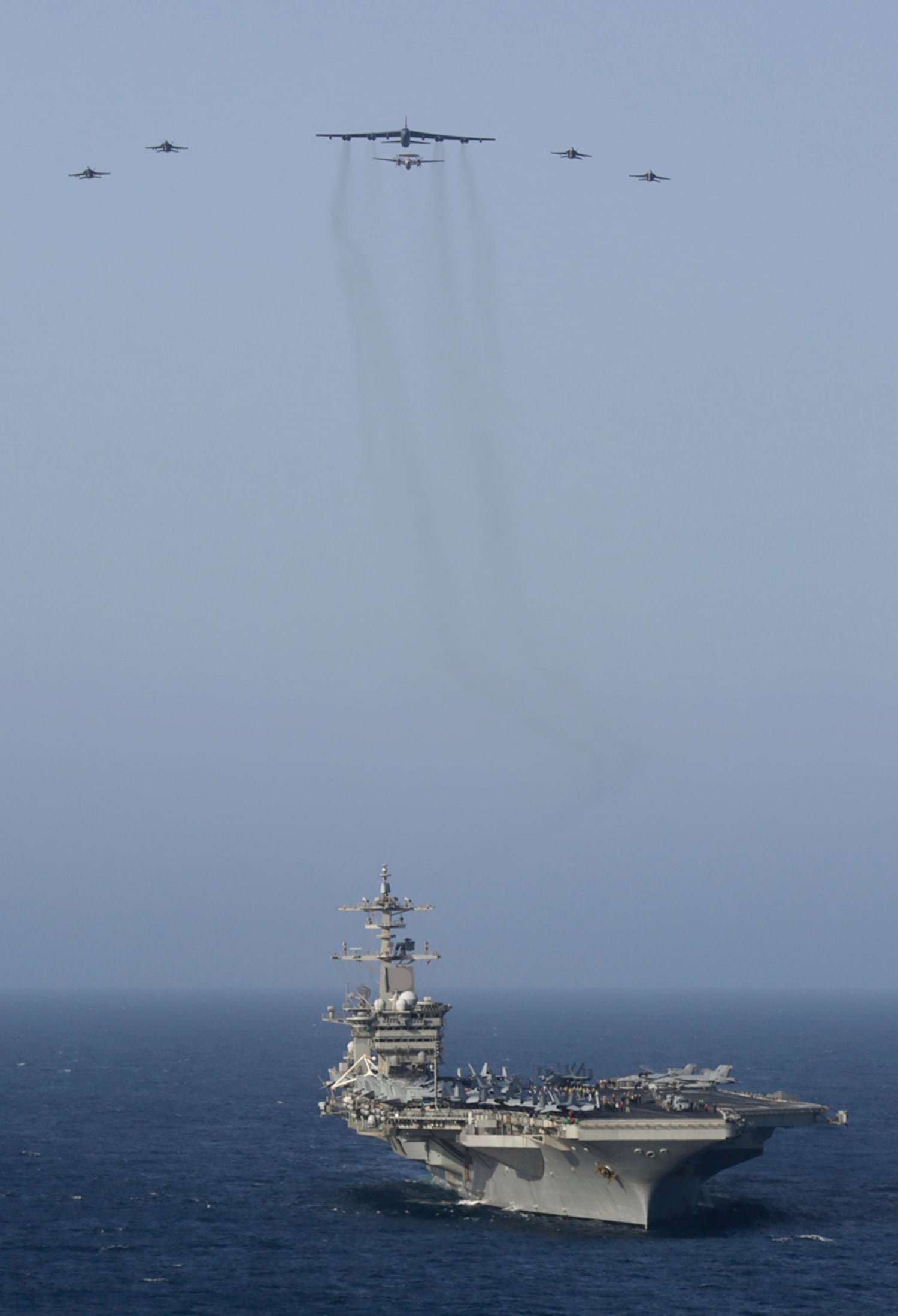 US aircraft carrier, B-52 — dispatched to Mideast over Iran — conduct ...