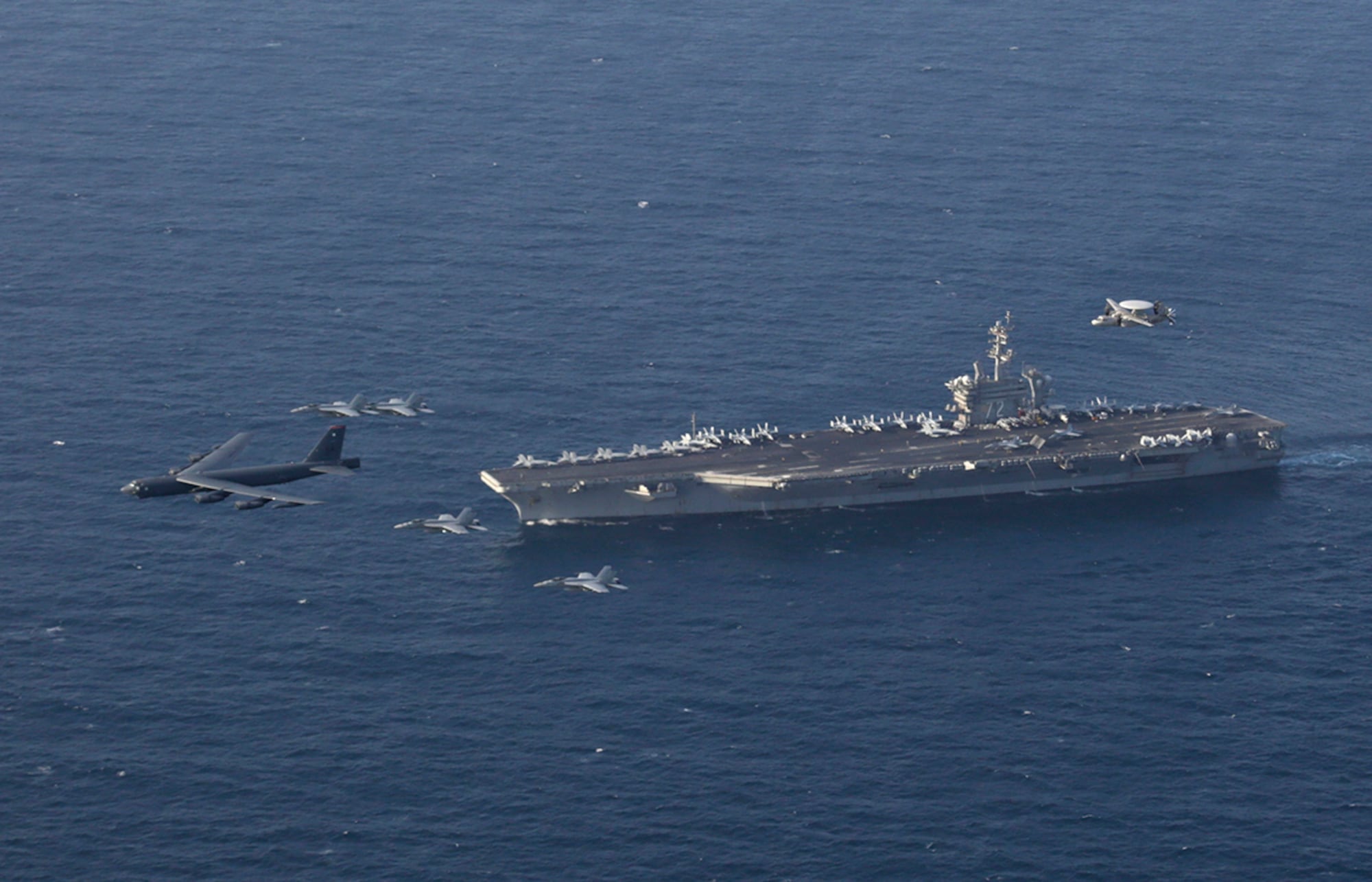 US aircraft carrier, B-52 — dispatched to Mideast over Iran — conduct ...